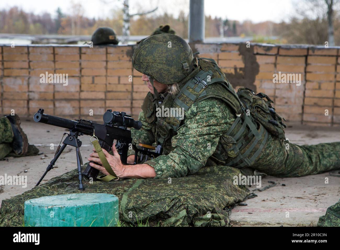 Man shooting at a target. Unformal shooting range Stock Photo - Alamy