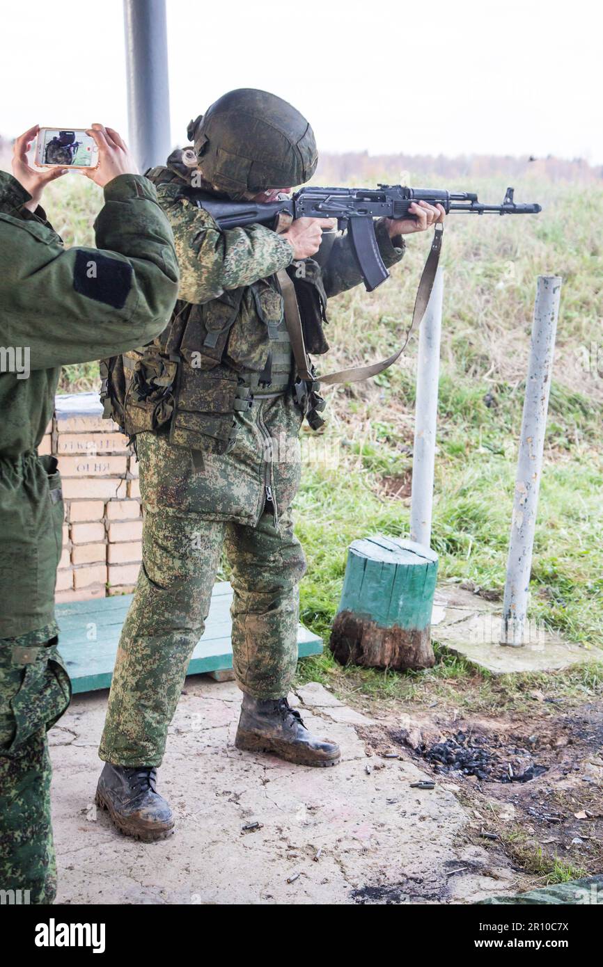 Man shooting at a target. Unformal shooting range Stock Photo - Alamy
