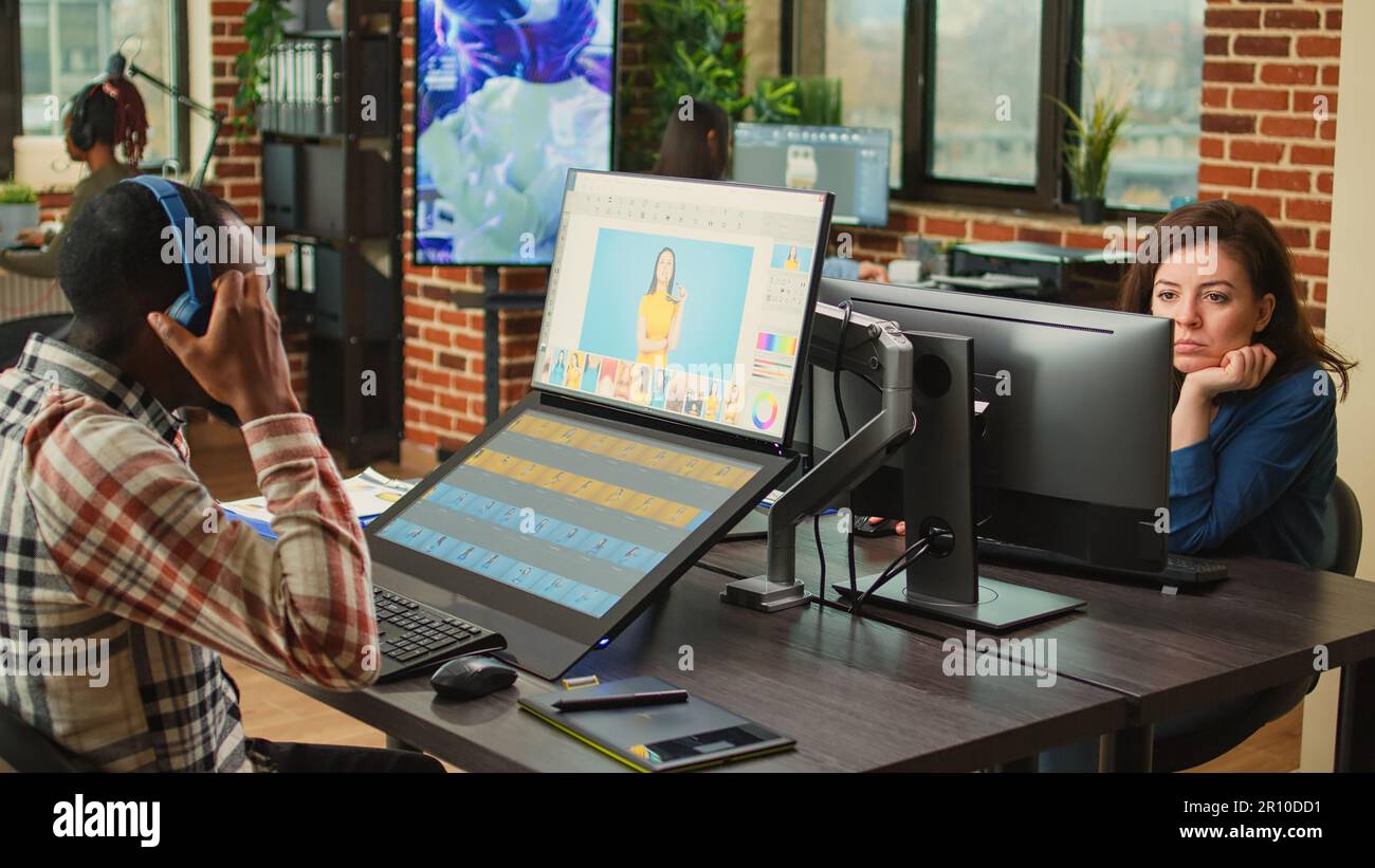 Young content creator retouching photos with color grading, using ...