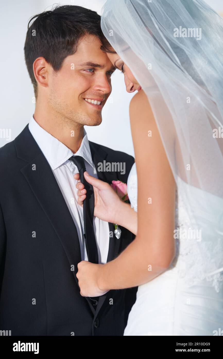 From this day forward...A young bride pulling affectionately on her ...