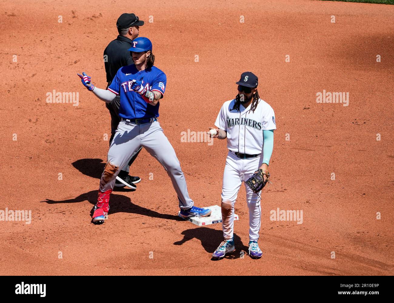 Texas Rangers' Jonah Heim reacts after hitting an RBI double as Seattle ...