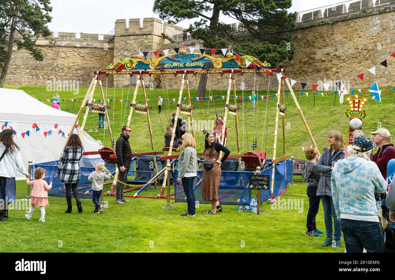 Swing Boats childrens fairground ride at Lincoln Castle on Day of King ...