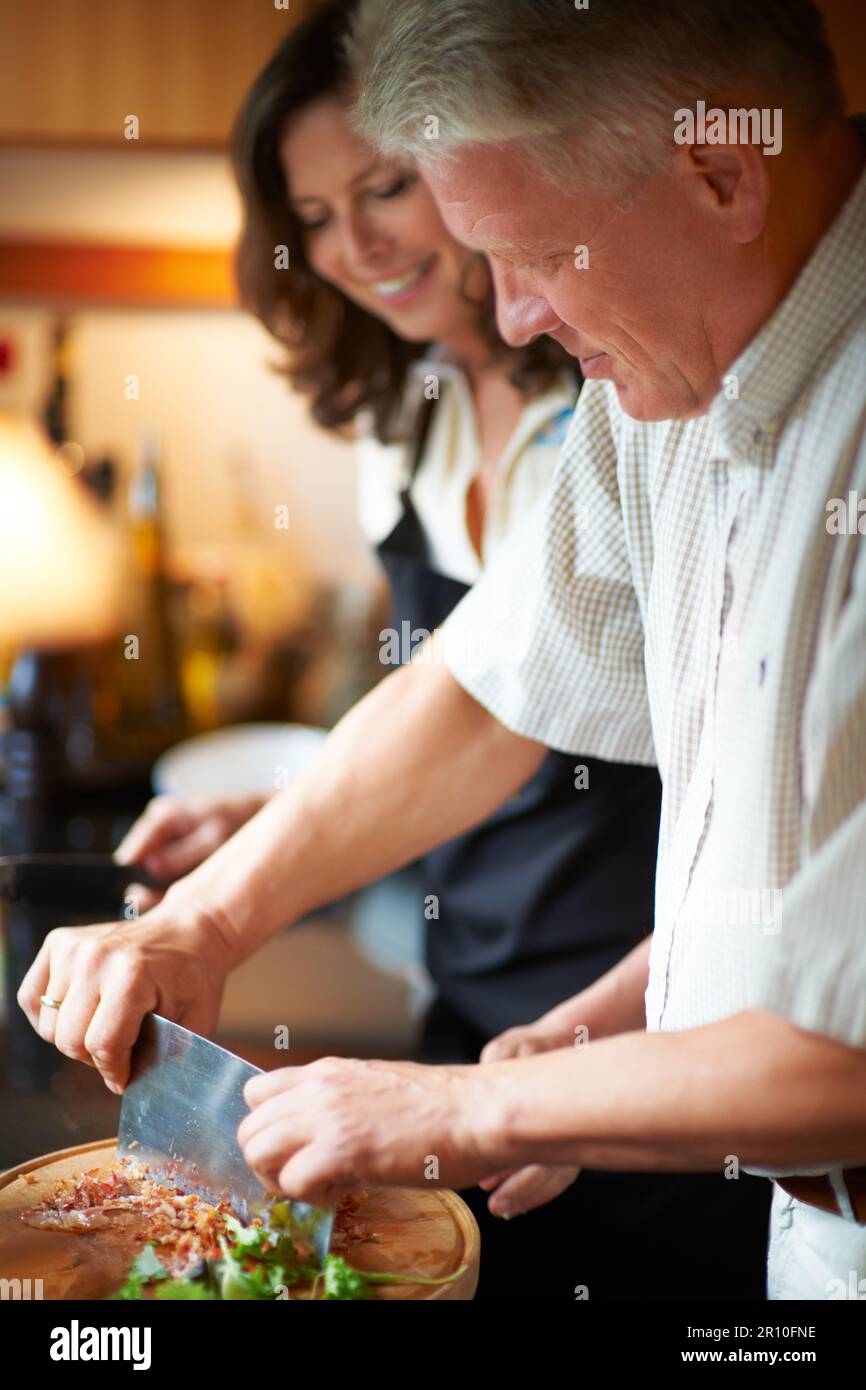 Mature woman cooking spices hi-res stock photography and images - Alamy