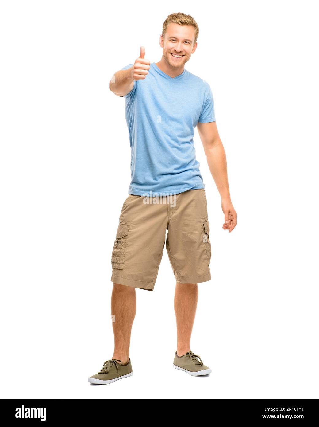 That sounds cool. Handsome young model showing thumbs up in studio ...