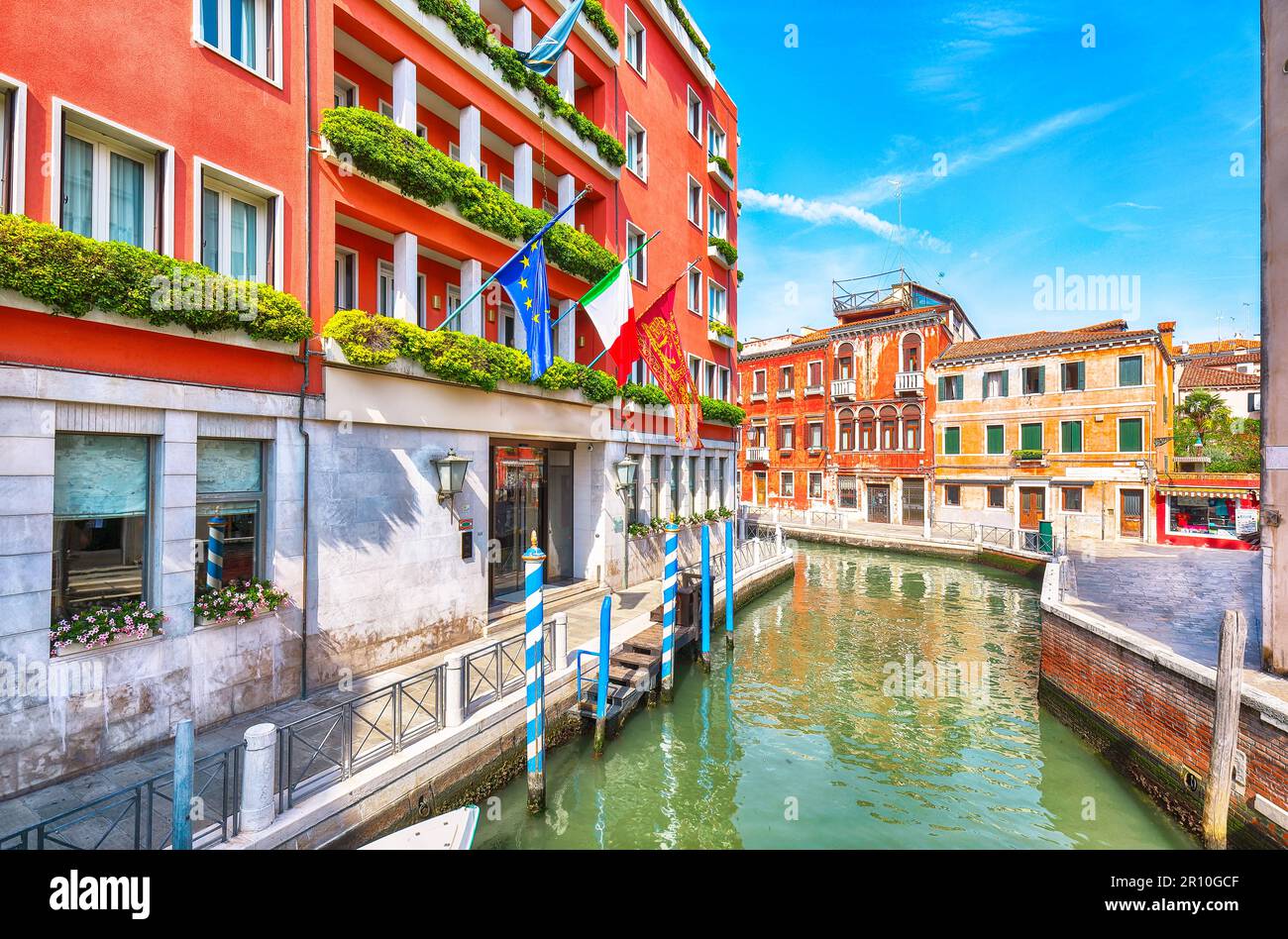 Fabulous cityscape of Venice with narrow canals, boats and gondolas and ...