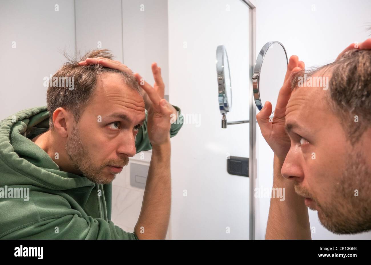 Man receding hairline mirror hi-res stock photography and images - Alamy