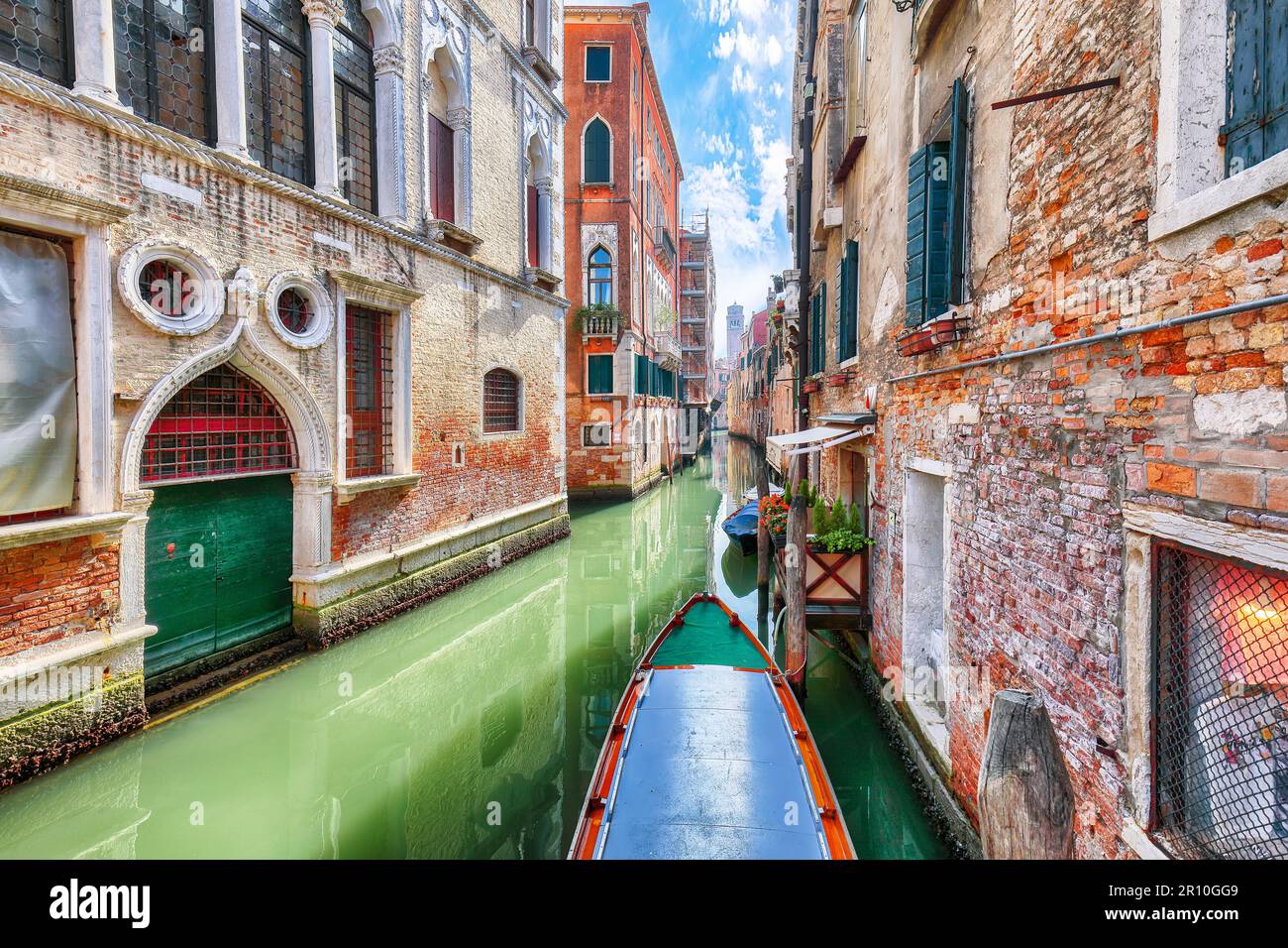 Fabulous cityscape of Venice with narrow canals, boats and gondolas and ...