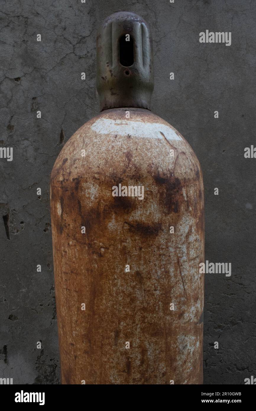 Scary looking abandoned rusty, moldy and old refrigerator gas cylinder ...
