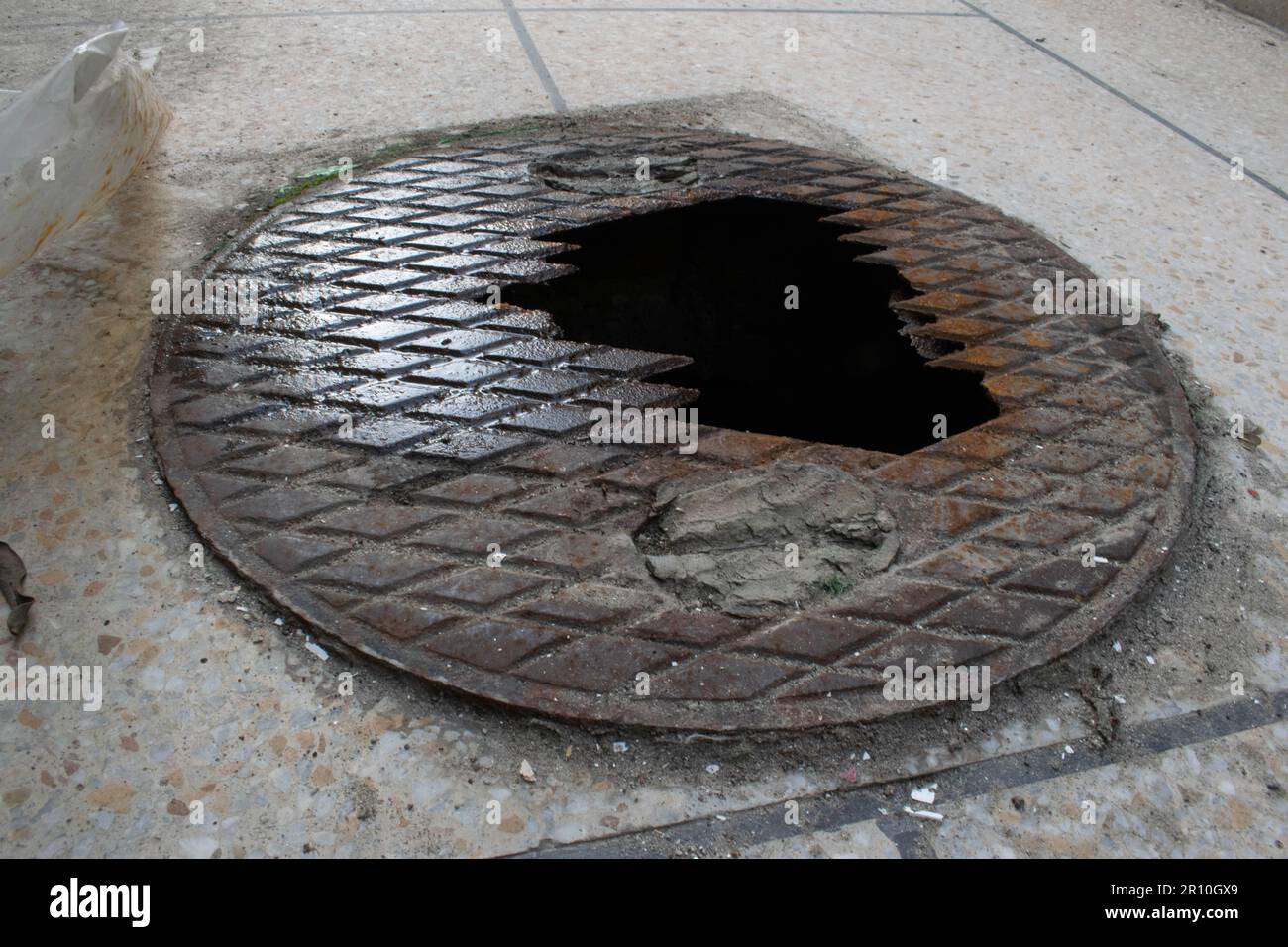 Broken manhole cover hi-res stock photography and images - Alamy