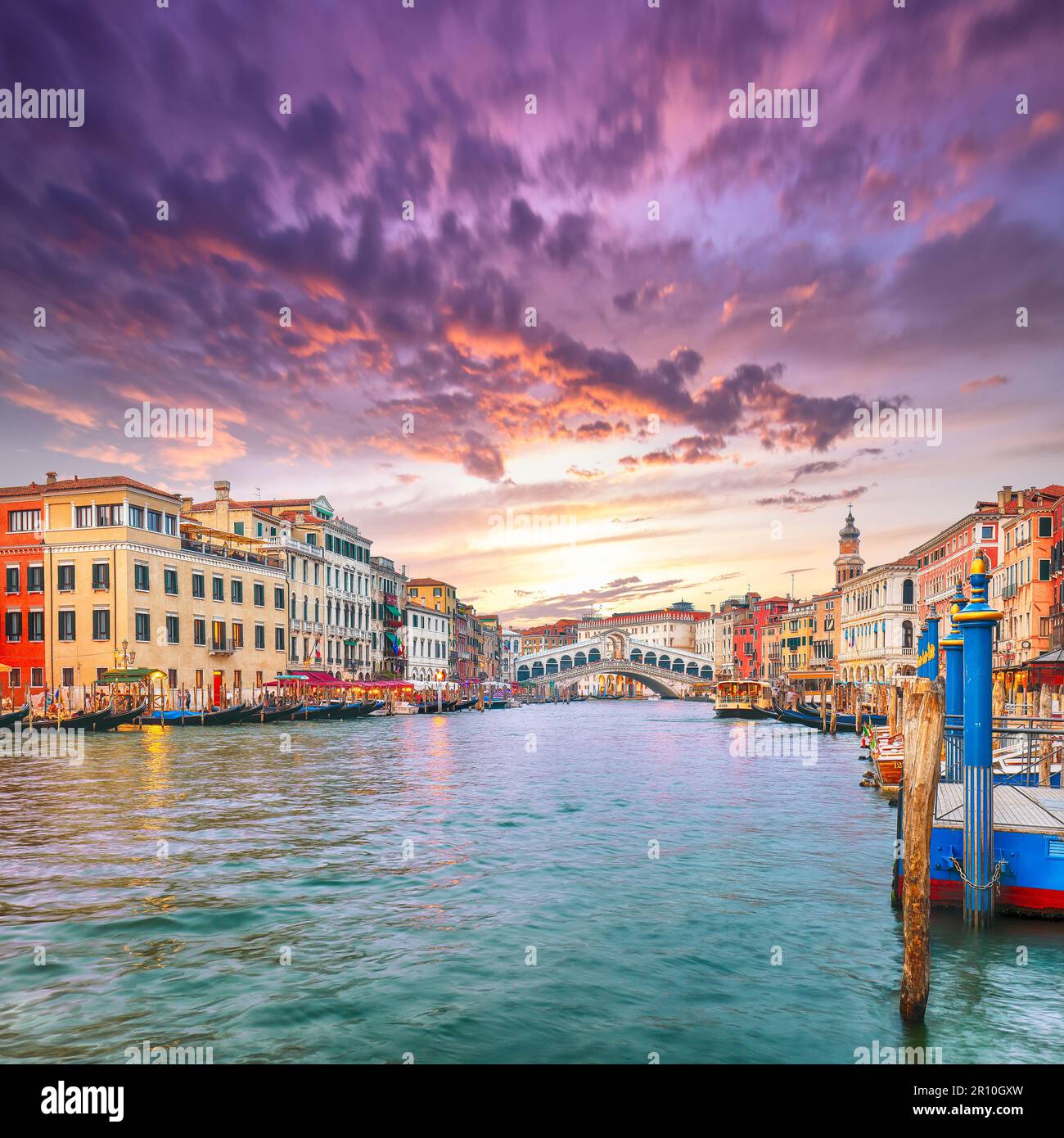 Amazing sunset and evening cityscape of Venice with famous Canal Grande ...