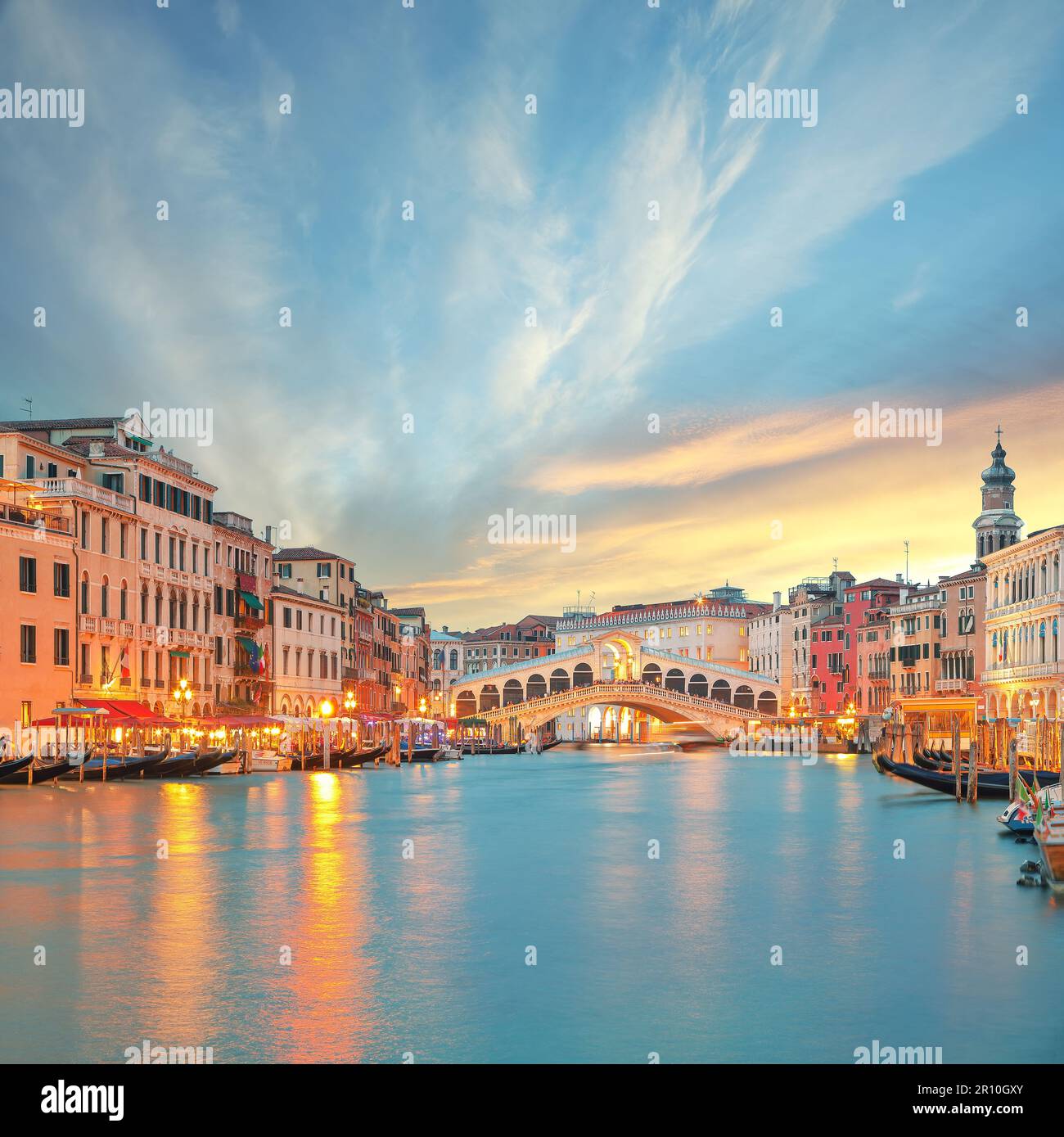 Stunning sunset and evening cityscape of Venice with famous Canal ...
