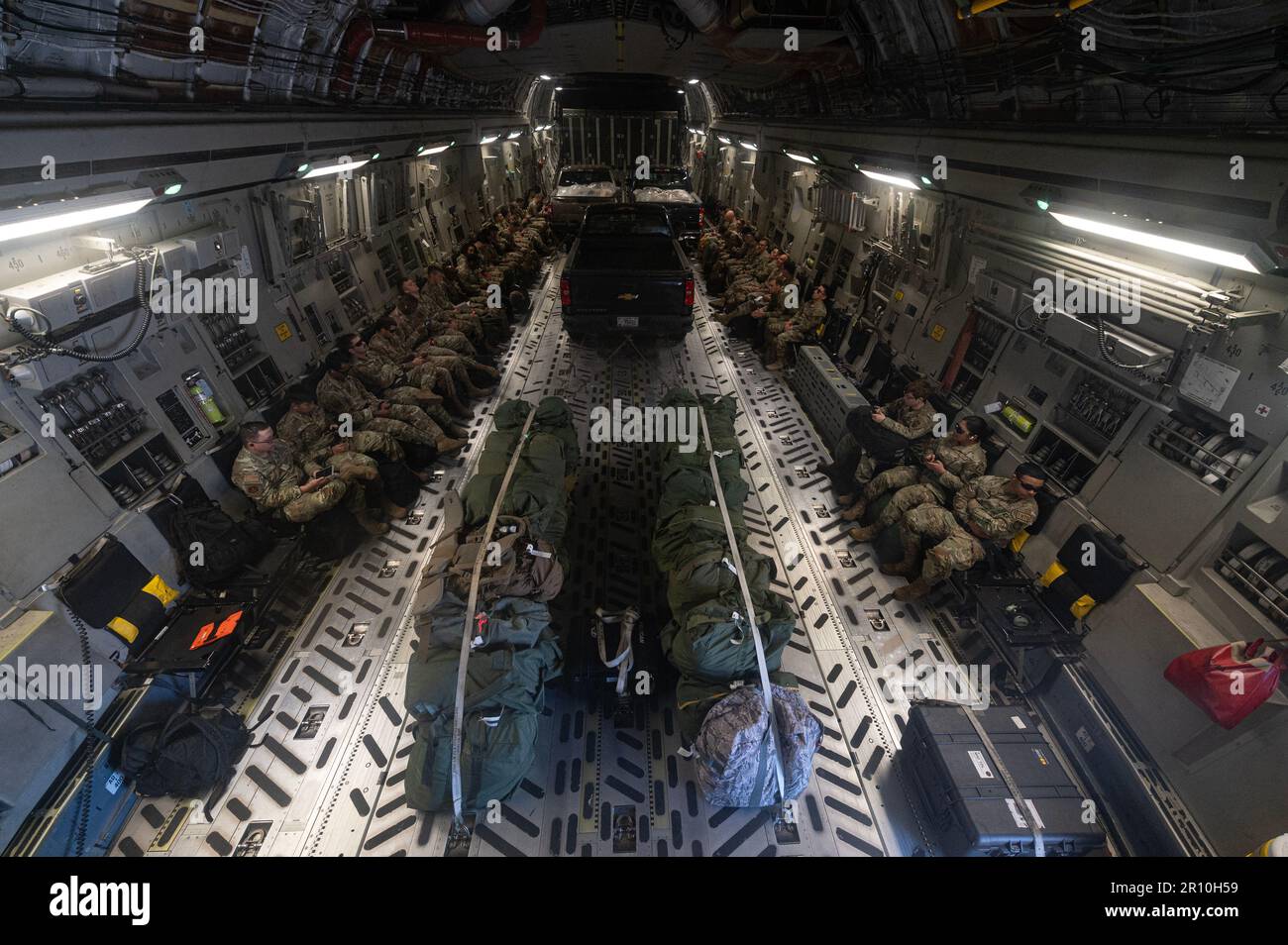 Airmen assigned to the 628th Civil Engineer Squadron (CES) sit on board ...
