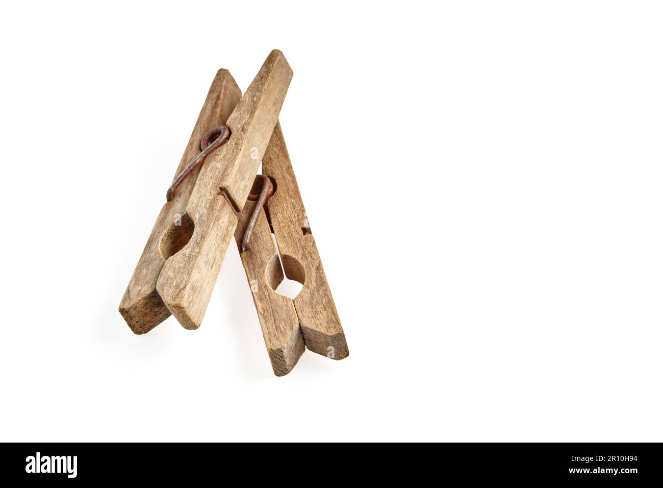 Two aged vintage wooden clothespin isolated on white background Stock ...