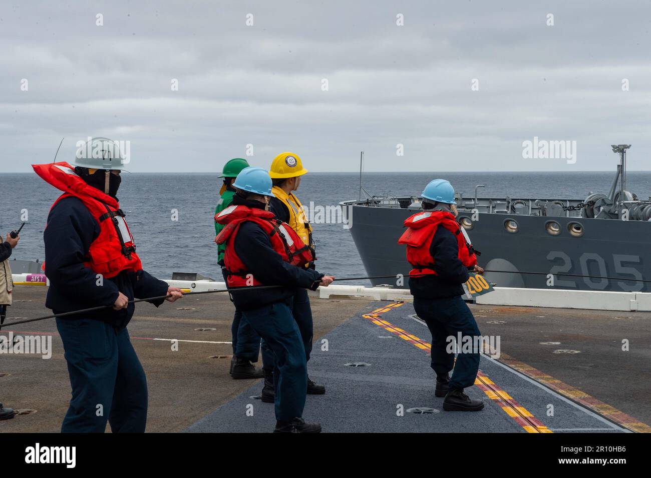 PACIFIC OCEAN (May 8, 2023) – U.S. Sailors handle a communication line ...