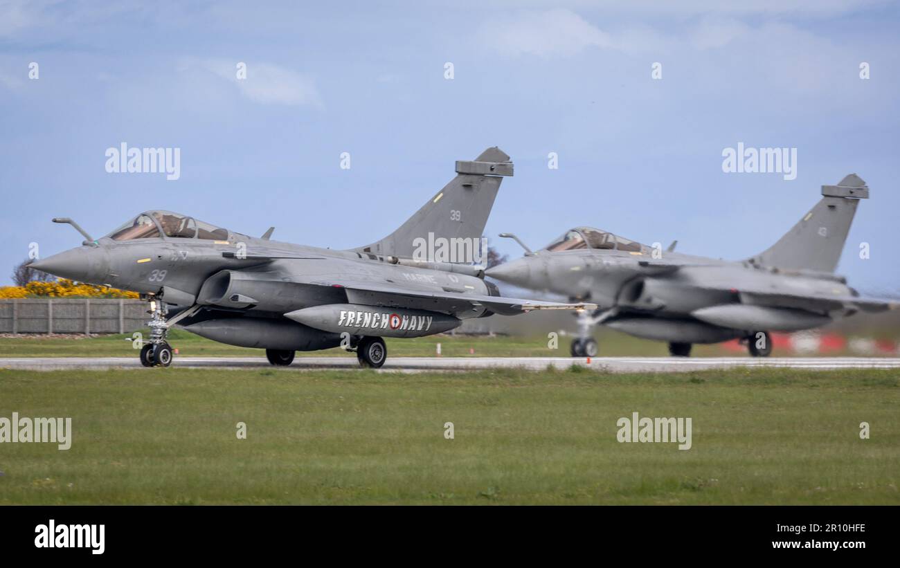 French Navy Rafales taking off, and French Navy Grumman E-2C Hawkeye ...