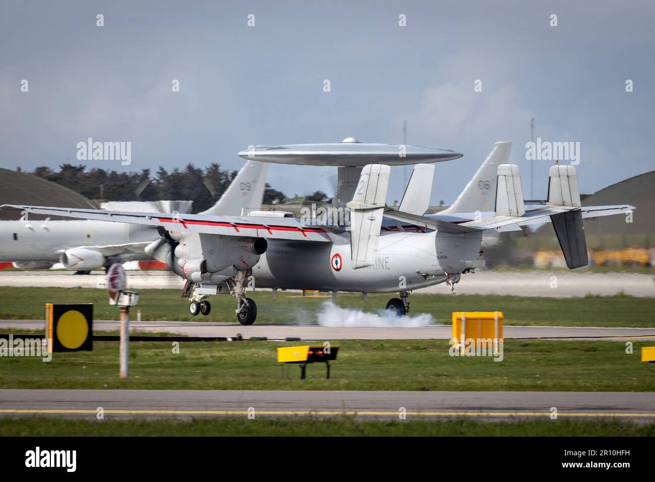French Navy Rafales taking off, and French Navy Grumman E-2C Hawkeye ...