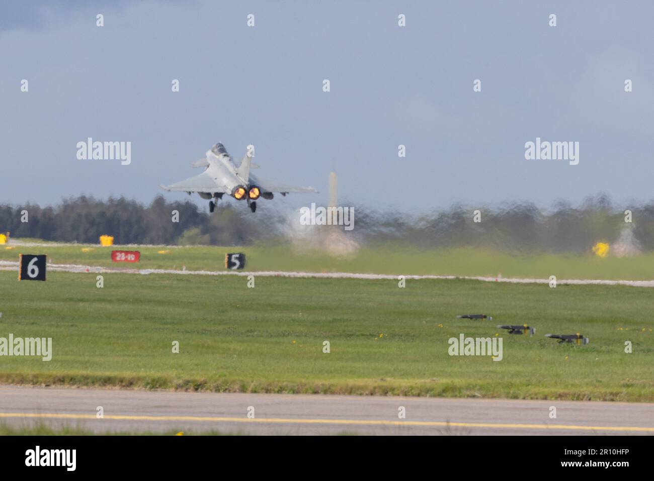 French Navy Rafales taking off, and French Navy Grumman E-2C Hawkeye ...