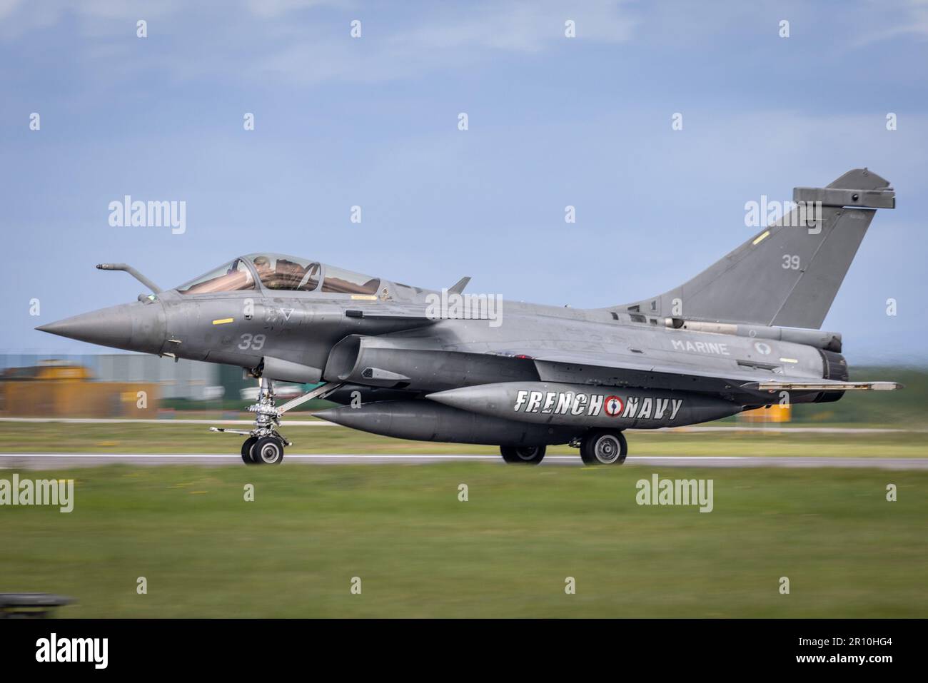French Navy Rafales taking off, and French Navy Grumman E-2C Hawkeye ...