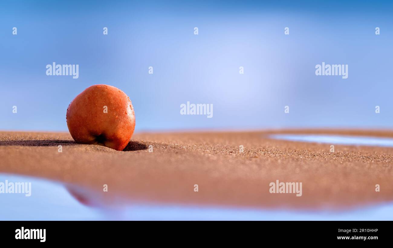 Beach apple hi-res stock photography and images - Alamy