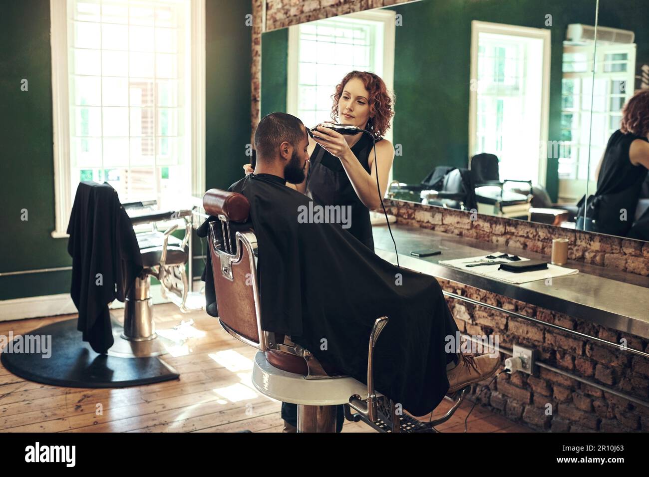 Change brings about confidence. an attractive young hairdresser ...