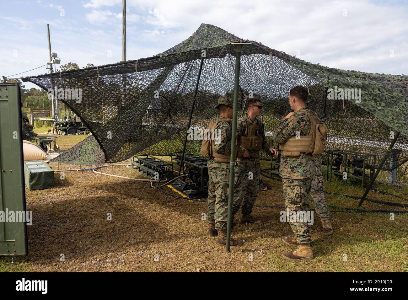 U.S. Marines with Marine Wing Support Squadron (MWSS) 271 watch over a ...