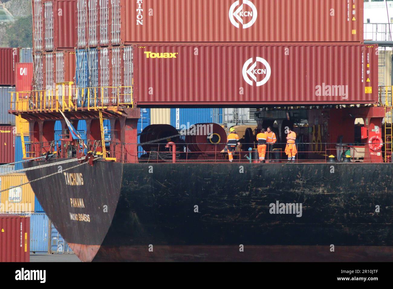Crew of the 167,000 ton container ship “Taichung” are dwarfed by the ...