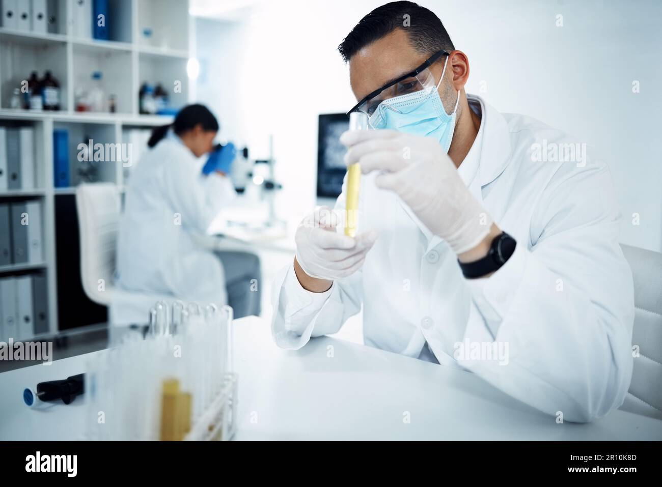 Lets get you all bottled up. a young scientist conducting medical ...