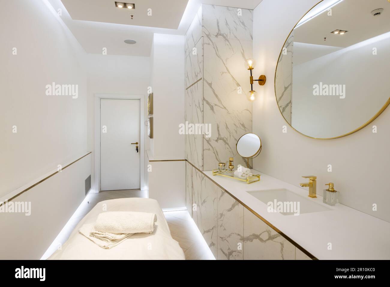 A facial care booth in a beauty center booth with marble partitions and ...