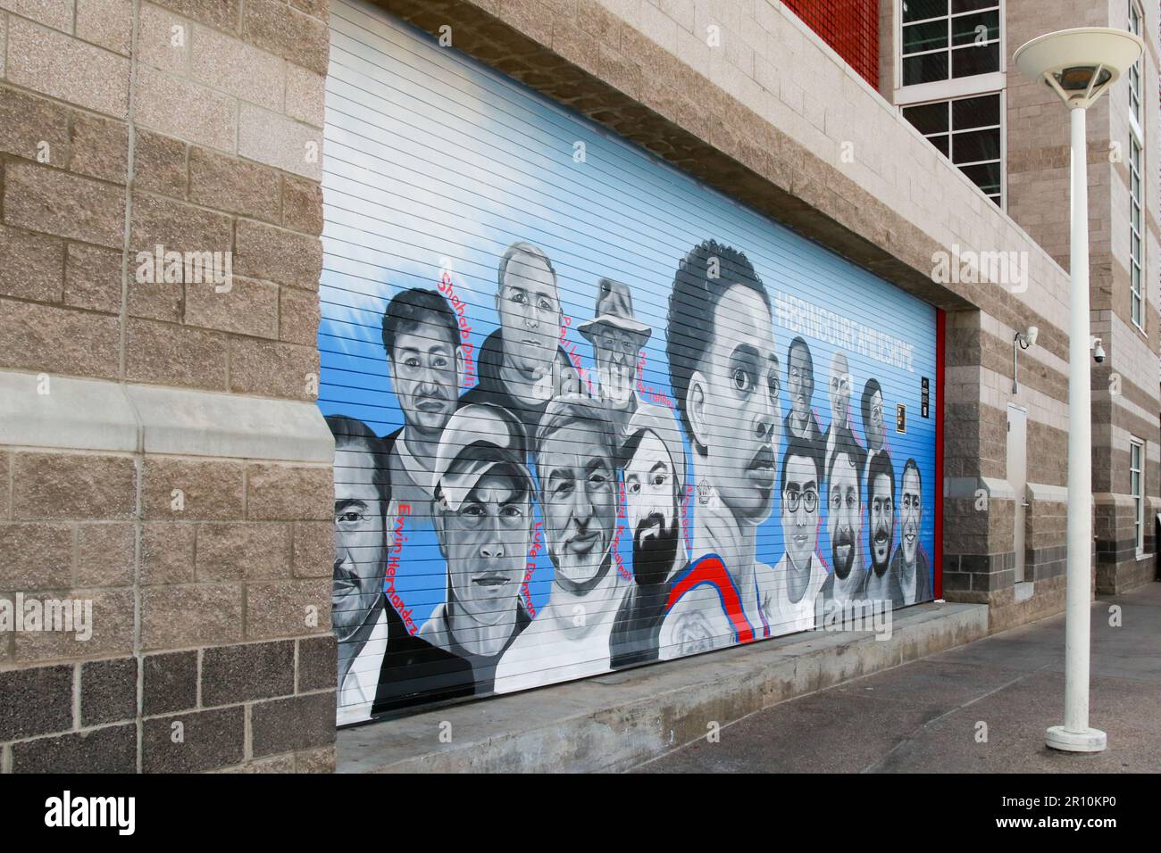 A 30-foot mural depicting people detained oversees is seen the west ...