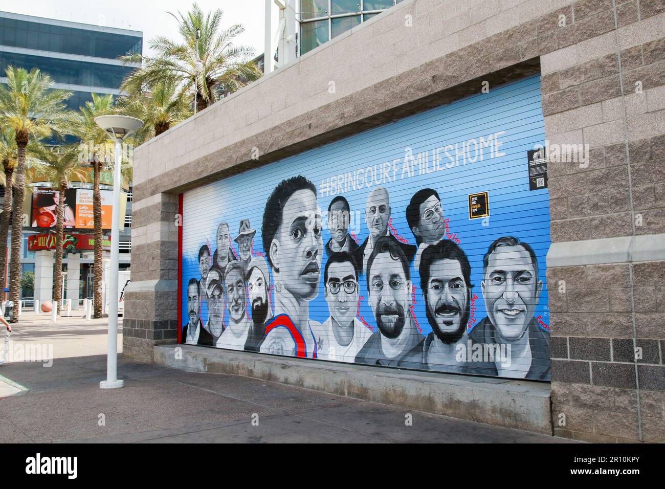 A 30-foot mural depicting people detained oversees is seen the west ...