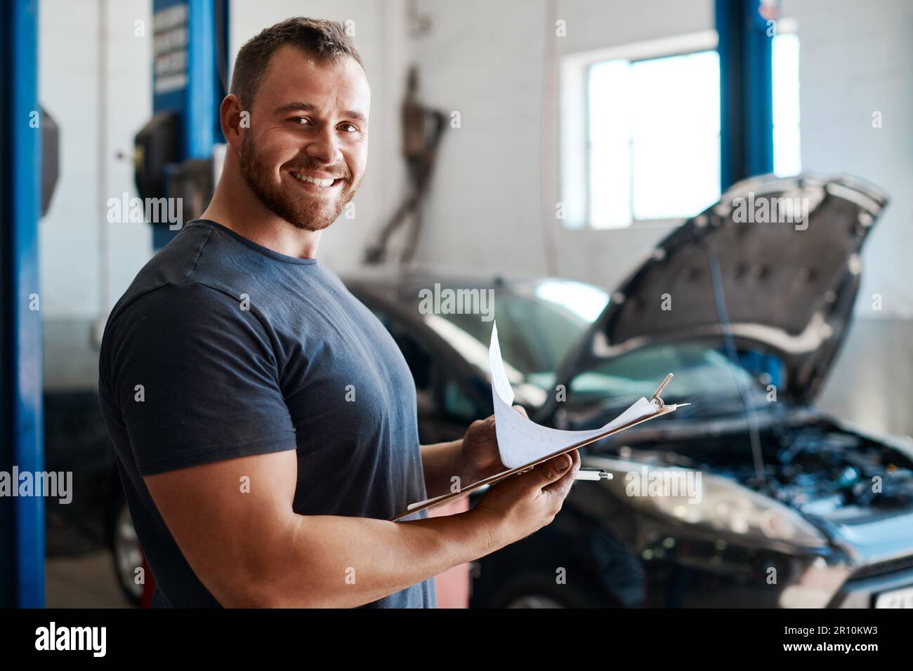With the right mindset, you can achieve anything. a mechanic holding a ...