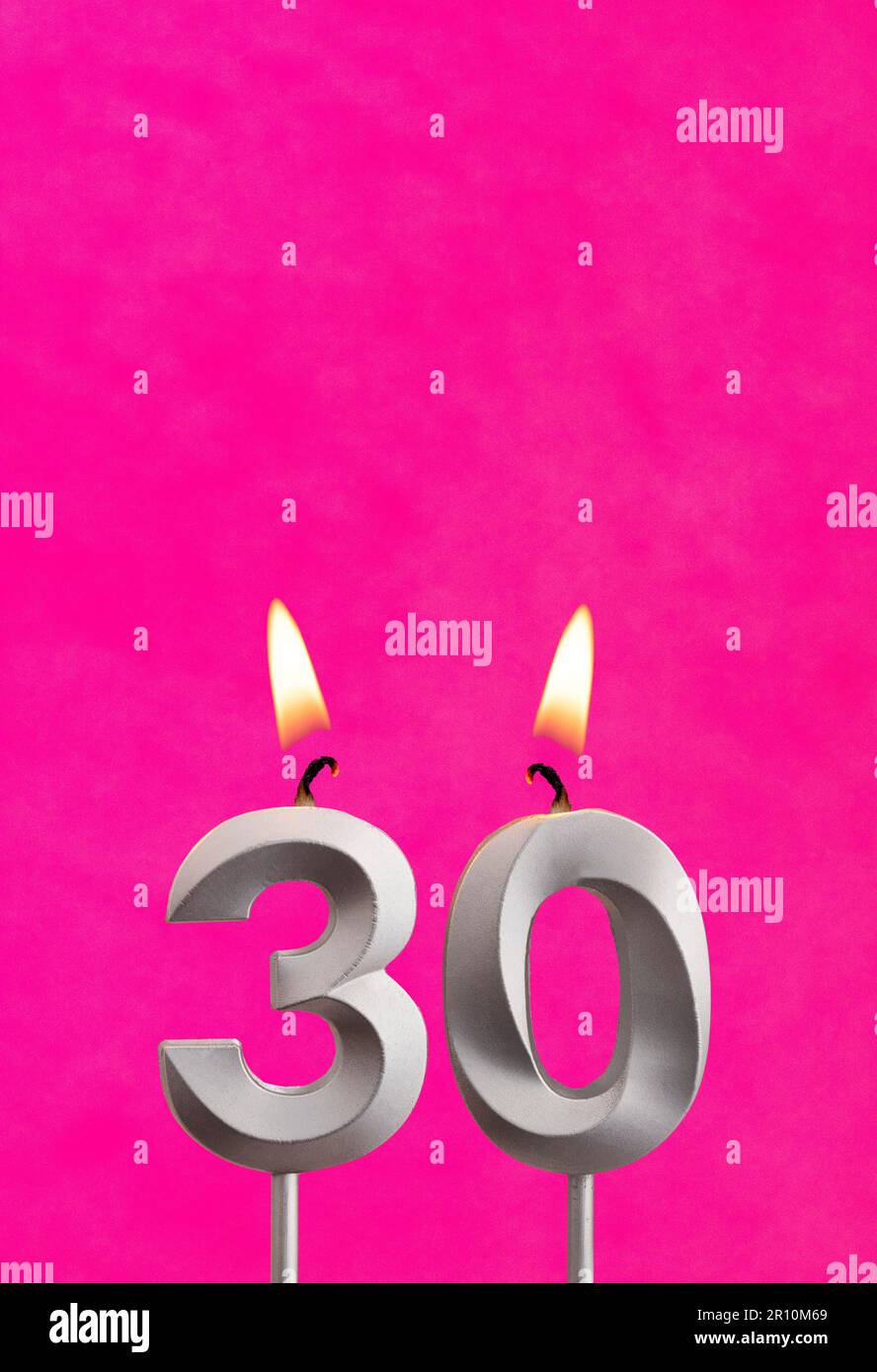 Candle 30 with flame - Silver anniversary candle on a fuchsia ...