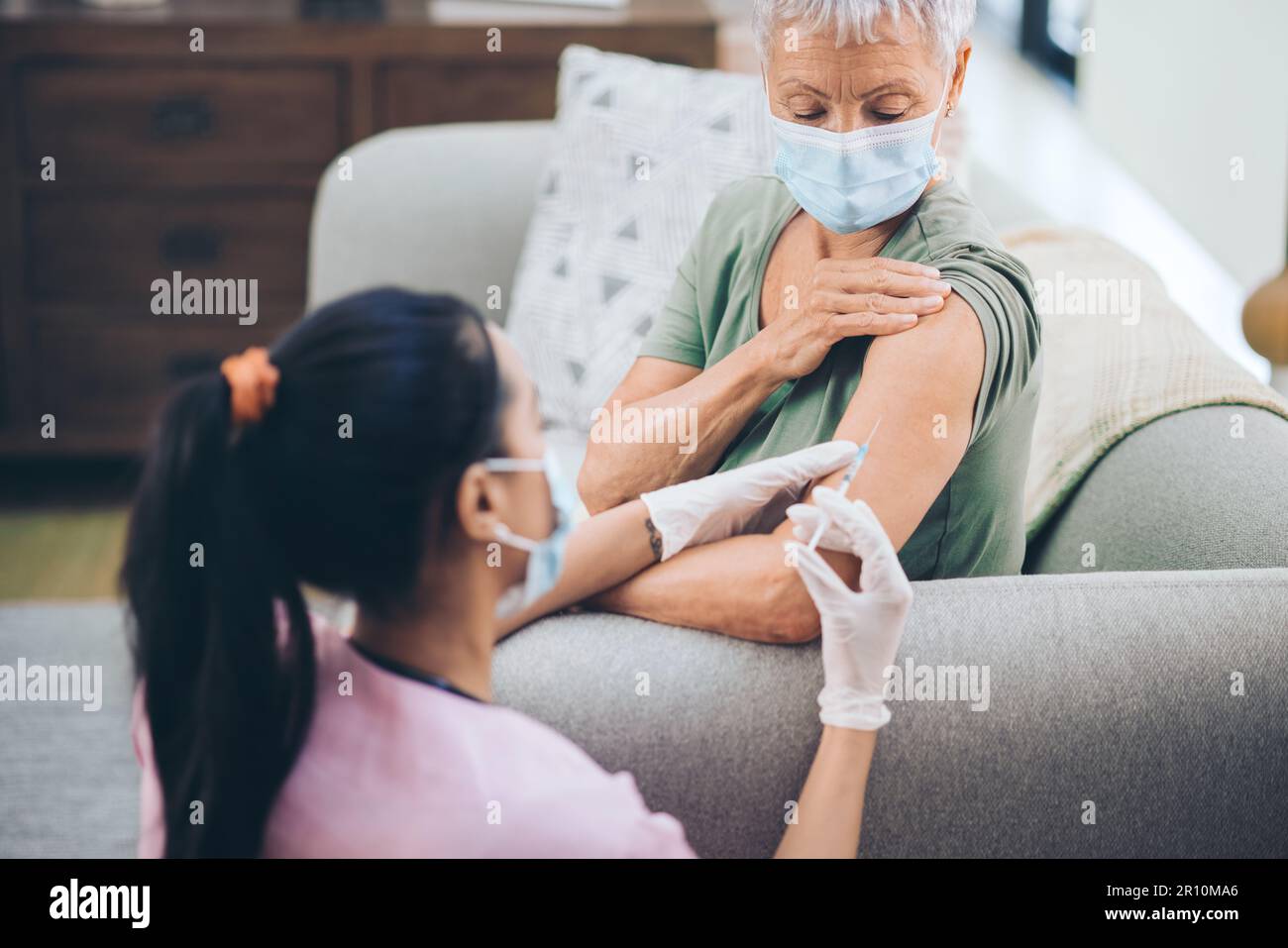 Deja vu happens a lot at my age. a doctor giving a masked older woman ...