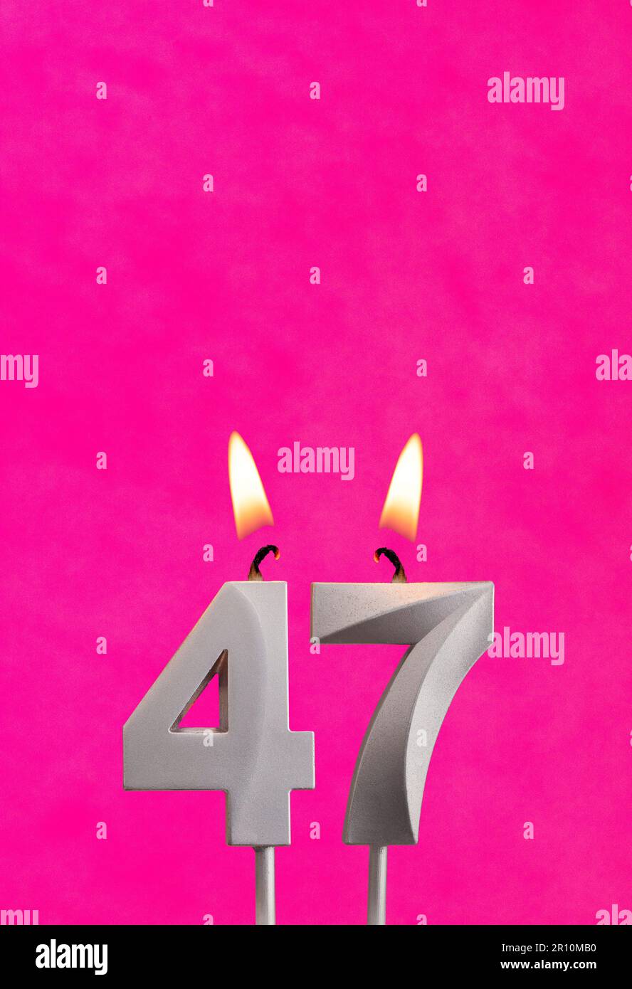 Number 47 candle - Birthday celebration on fuchsia background Stock ...