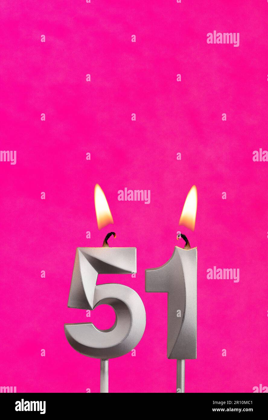 Number 51 candle - Birthday celebration on fuchsia background Stock ...