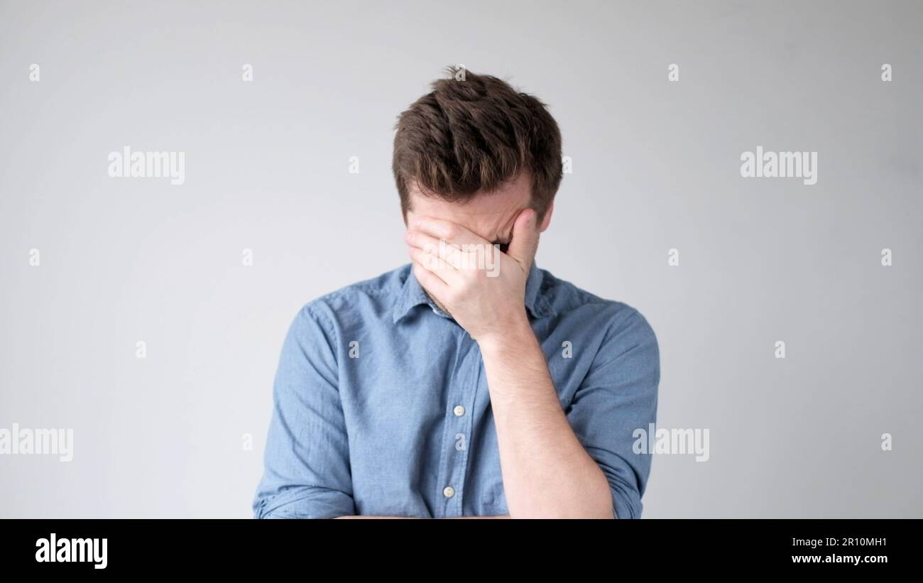 European young man barely holding back tears from problems and stress ...