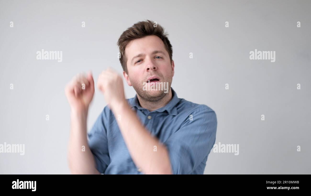 European young man playfully dances and moves with joy Stock Photo - Alamy