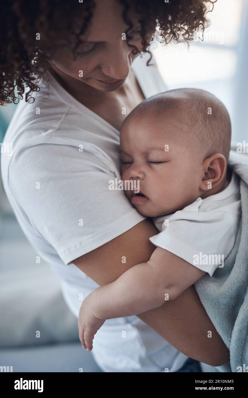 Id choose moms arms over a crib any day. an adorable baby girl sleeping ...
