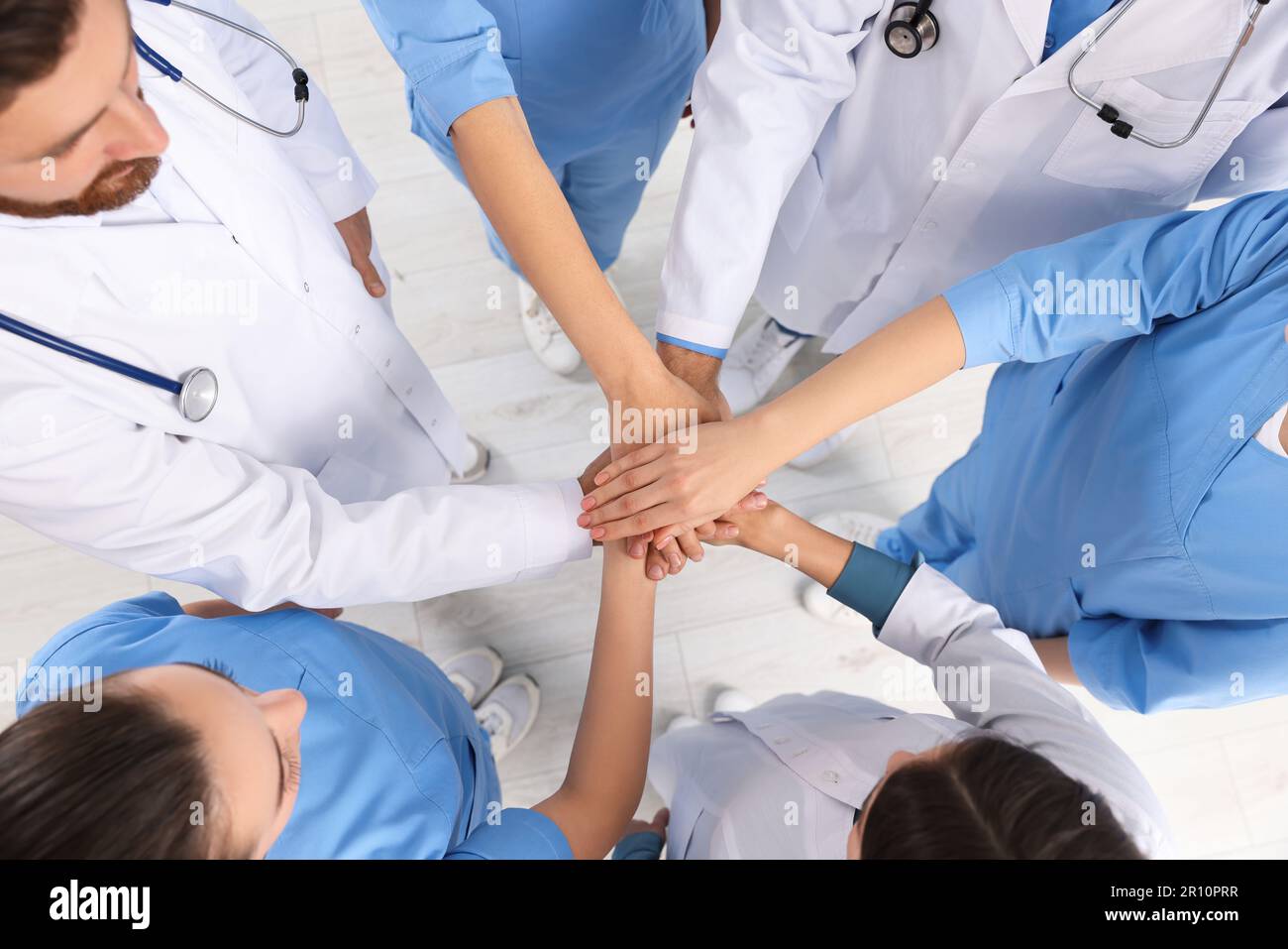 Top view male hands putting hi-res stock photography and images - Alamy