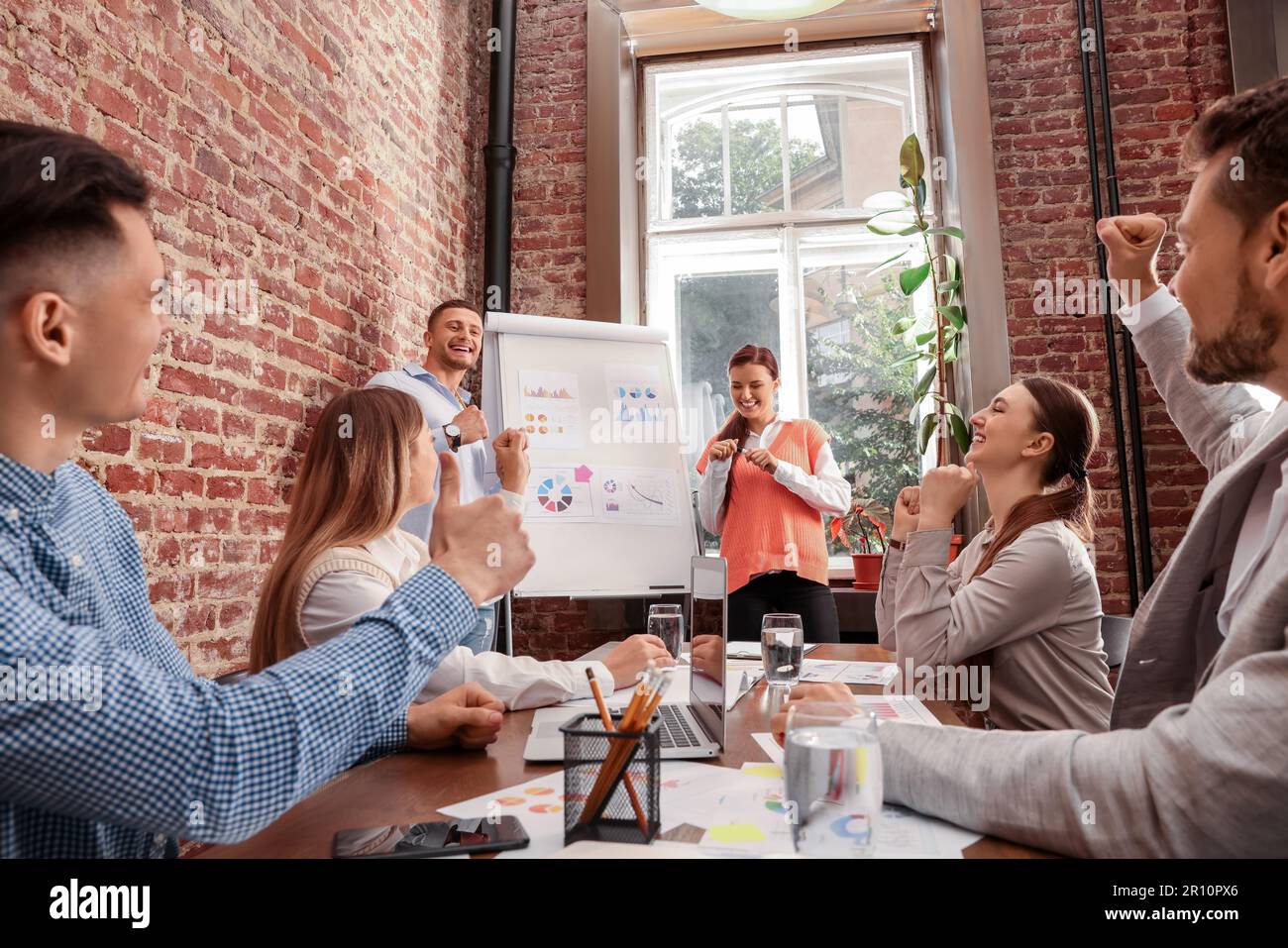 Employees having meeting in office. Team work Stock Photo - Alamy