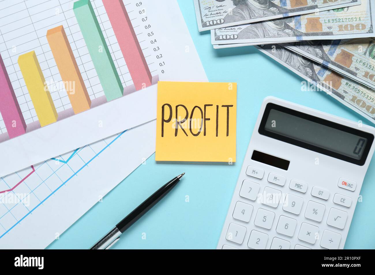 Sticky note with word Profit, diagram, banknotes and calculator on ...