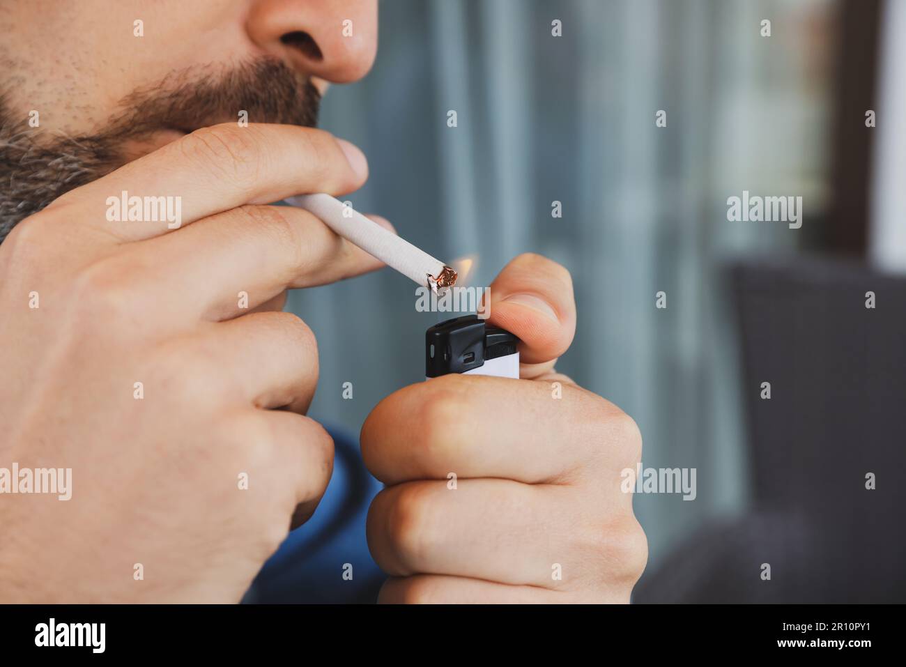 Mature man lighting cigarette, closeup of hands Stock Photo - Alamy