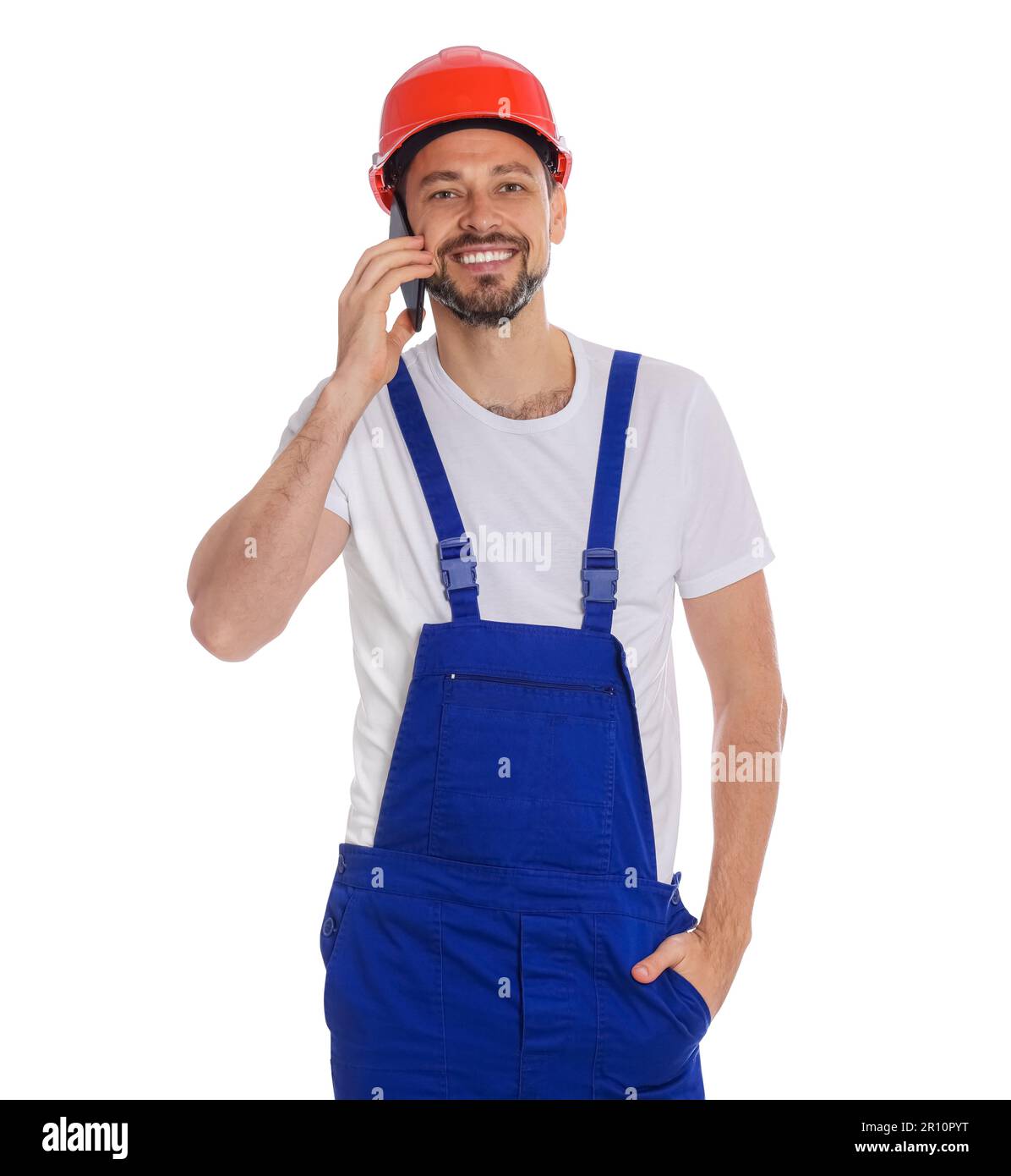 Professional repairman in uniform talking on phone against white ...