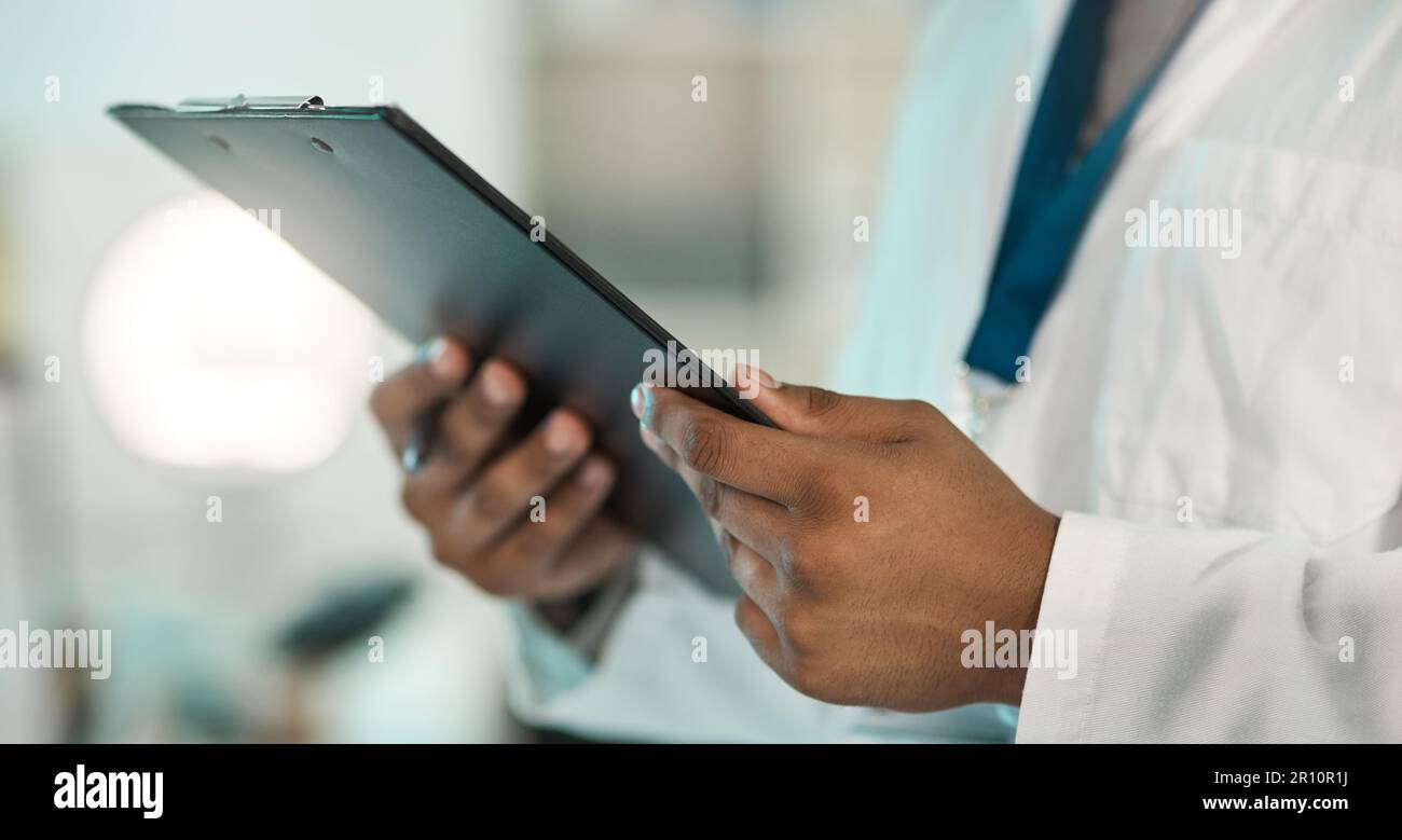 Reading through notes on his latest discovery. Closeup shot of an ...