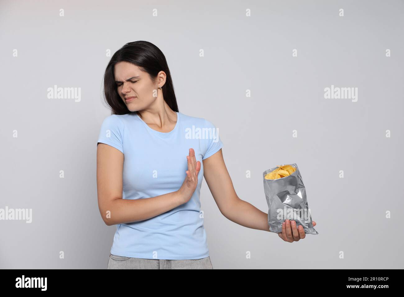 Woman refusing eat chips hi-res stock photography and images - Alamy