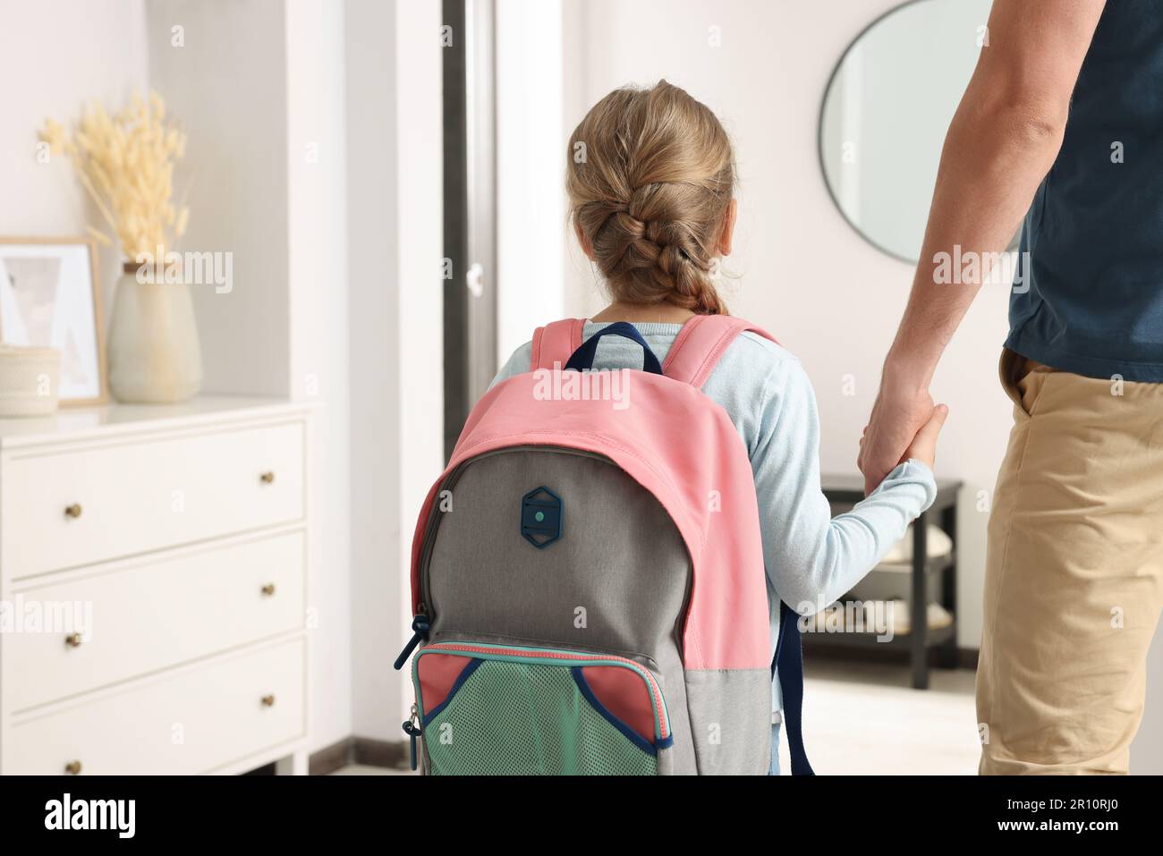Little girl with father at home. Ready to go to school Stock Photo - Alamy