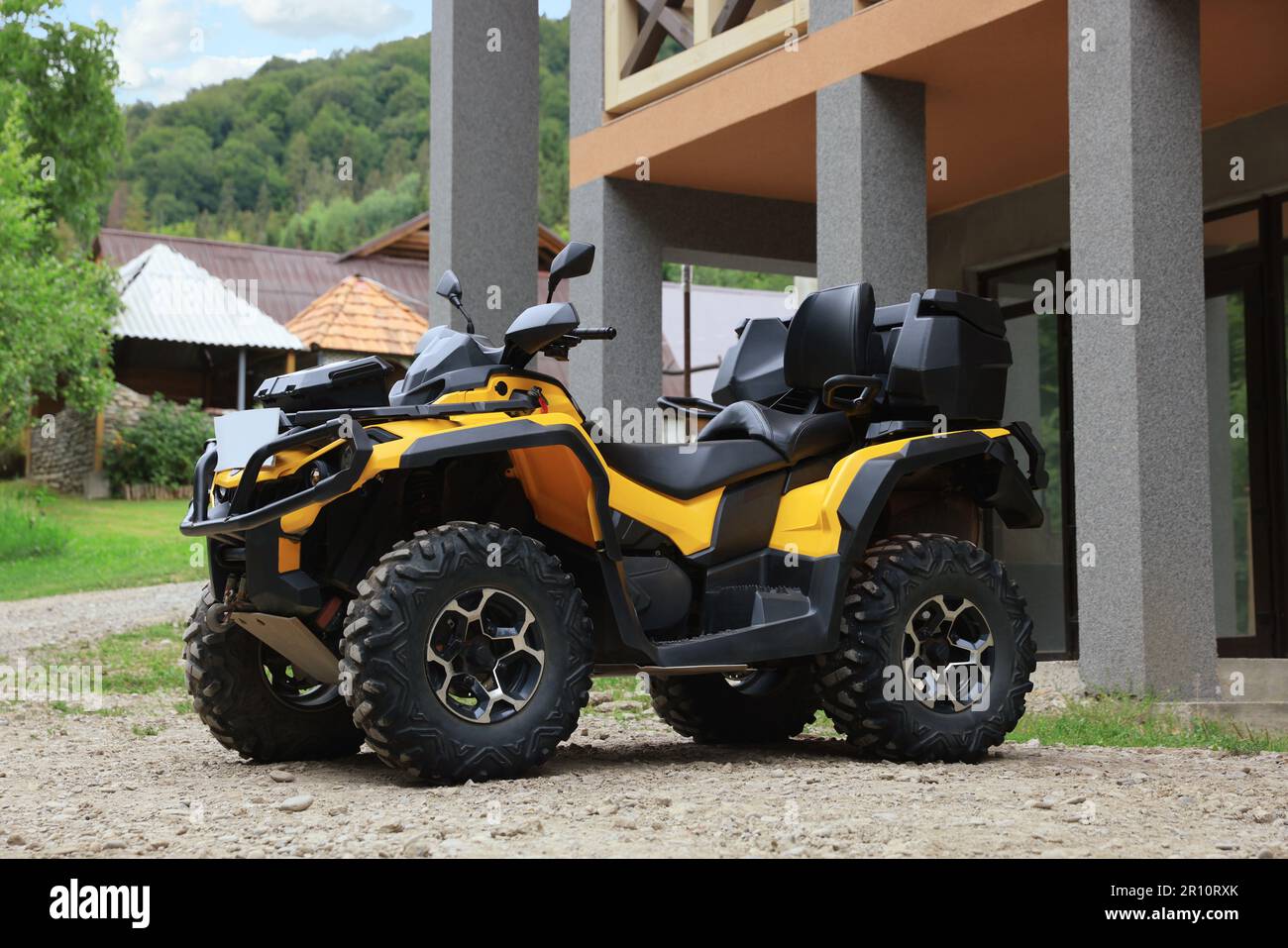 Modern offroad quad bike near building outdoors Stock Photo - Alamy