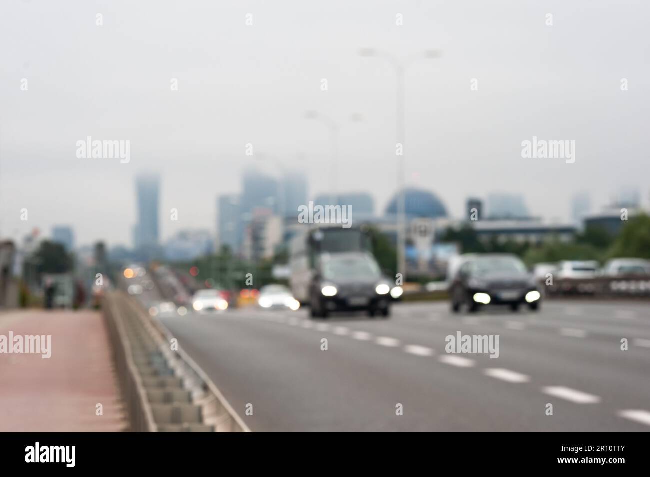 Blurred view of city road with cars Stock Photo - Alamy