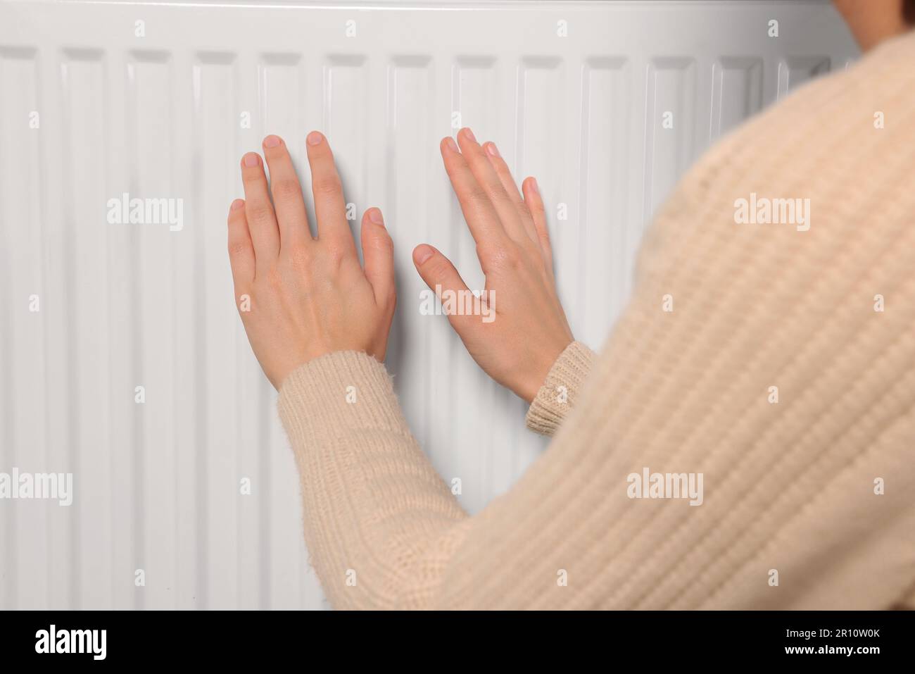 Female hands on radiator hi-res stock photography and images - Alamy
