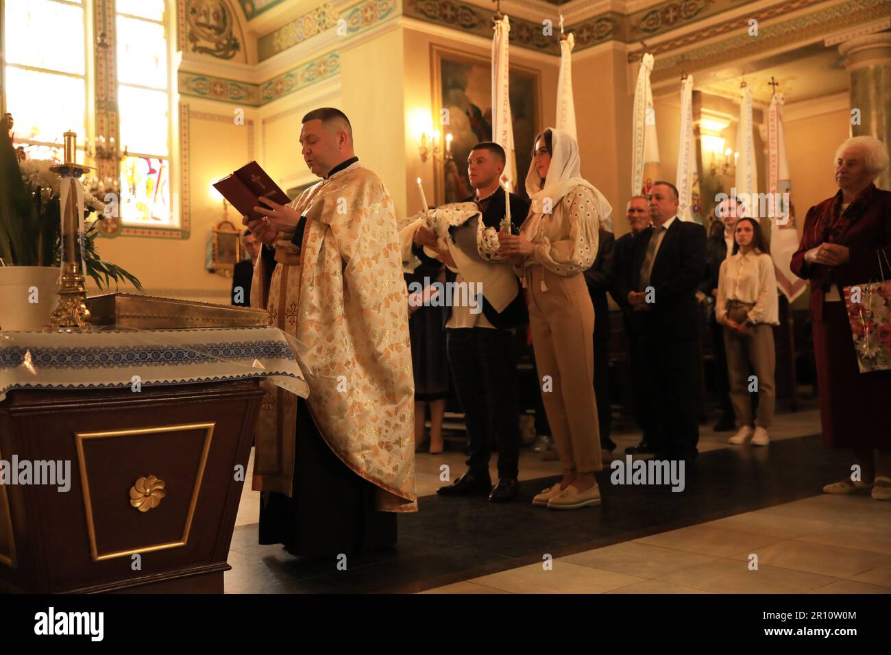 Stryi, Ukraine - September 11, 2022: Priest conducting baptism ceremony ...